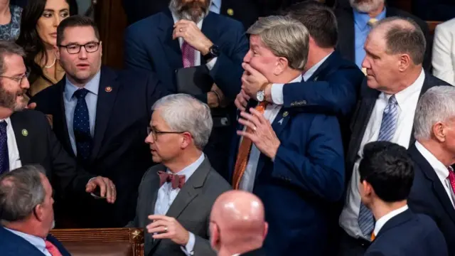 Republican Representative from Alabama Mike Rogers is restrained after yelling at Republican Representative from Florida Matt Gaetz,