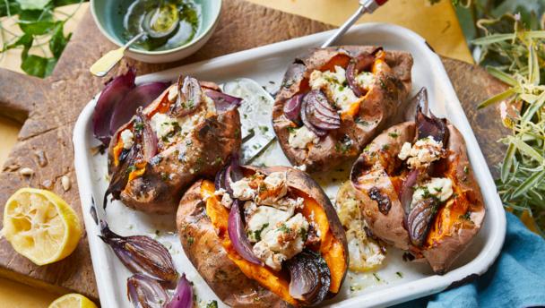 Loaded baked potatoes - BBC Food