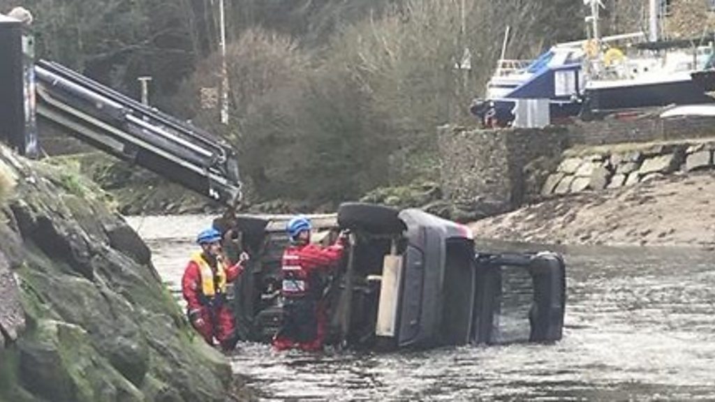 Three rescued from car stuck in river in lower Fishguard - BBC News