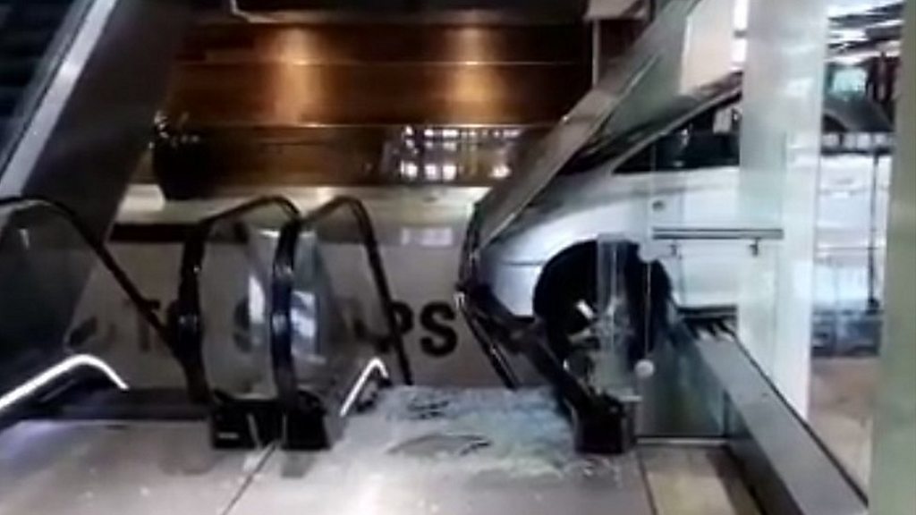 Car crashes through glass window at Westfield Stratford - BBC News