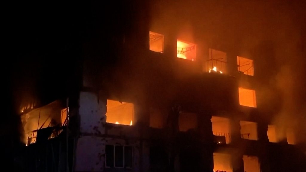 Flames rise from Ukrainian buildings after Russian strike