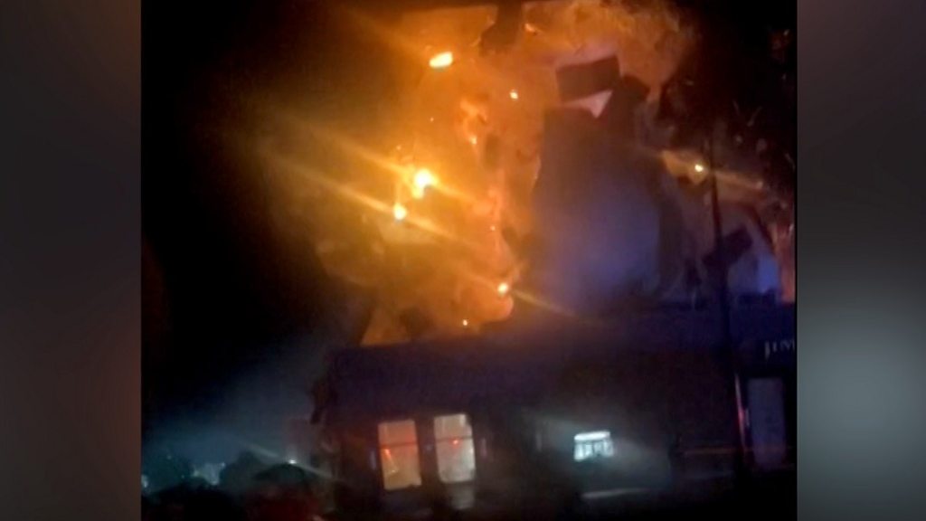 Explosion rips through Domino's restaurant after car crashes into building