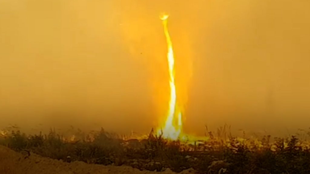 Officials watch as fiery cyclone grows over 200 ft high