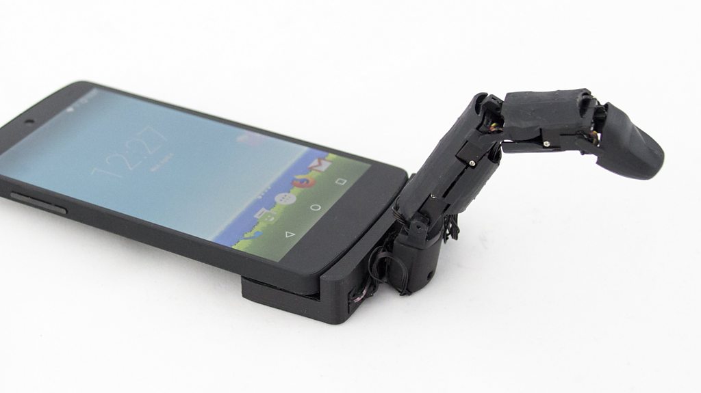 Feely finger phone crawls across desk