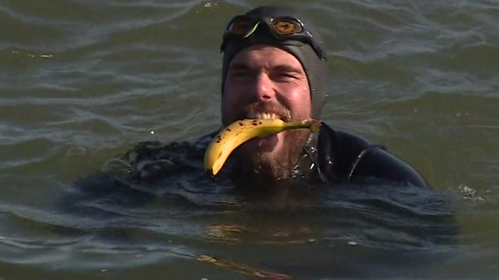 First man to swim around Britain - BBC News