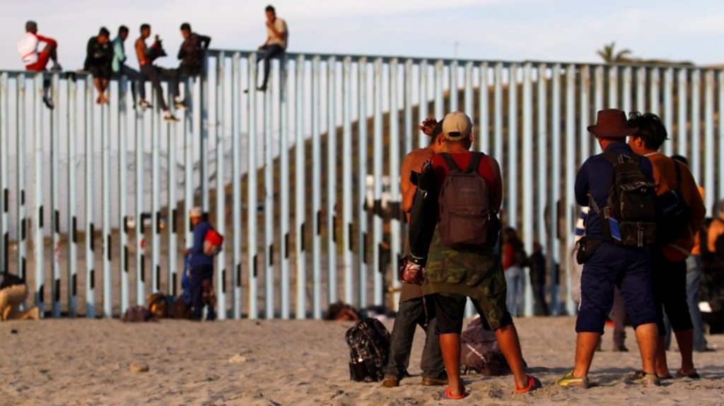 Caravan migrants reach US border