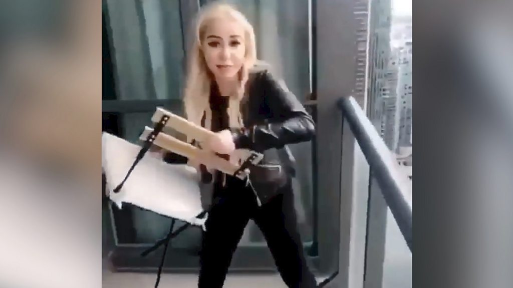 Woman throws chair from high-rise balcony - BBC News