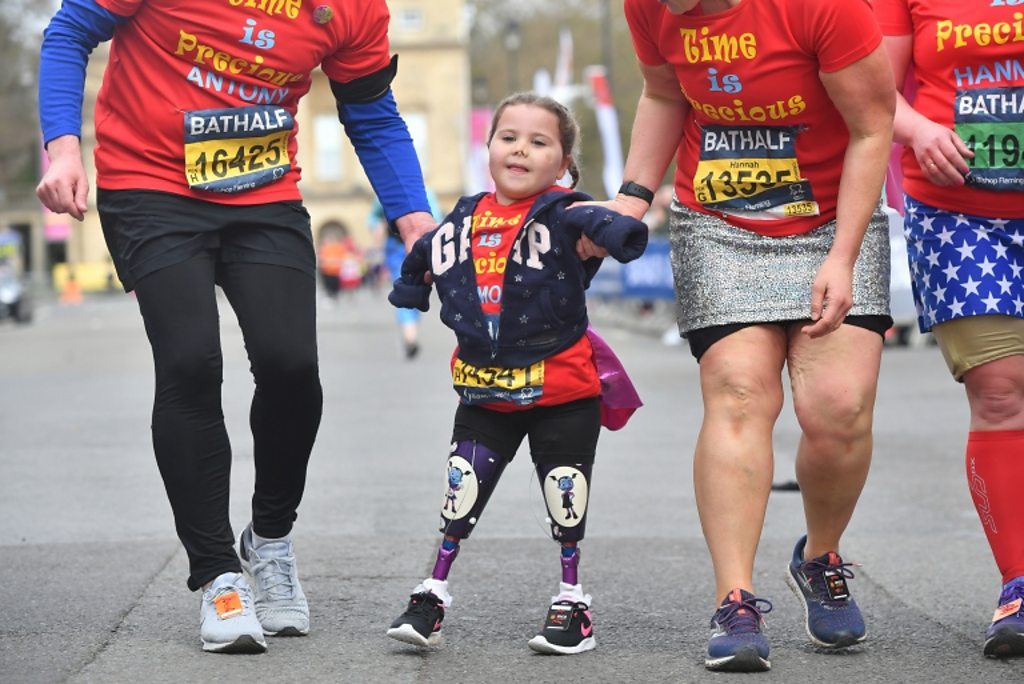 Limbless girl's half-marathon success - BBC News