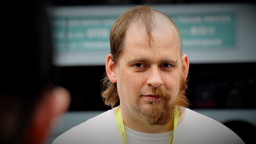 Nottingham bus drivers shave off half their hair - BBC News