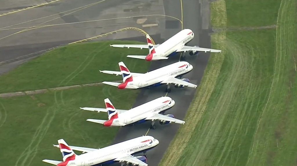 Grounded planes fill airport runways