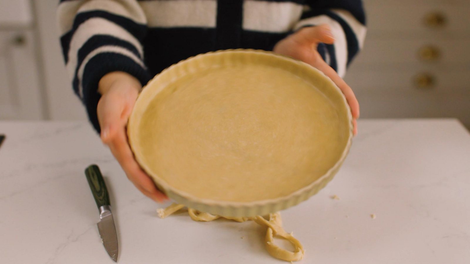 Lining a tart tin: trimming the pastry - BBC Food
