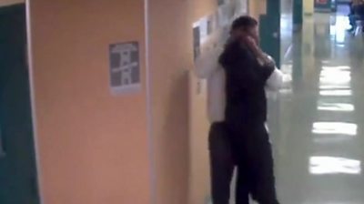 The moment a school employee lifts student by neck - BBC News