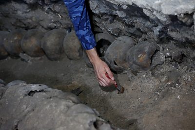 Uncovering the Aztec tower of skulls in Mexico City - BBC News