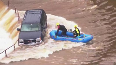 Woman rescued from flooded road in Oklahoma - BBC News