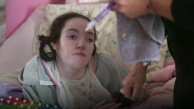 Mother 'lives' for brain damaged 19-year-old daughter - BBC News