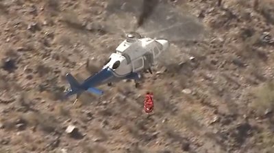 Rescued hiker is spun around by helicopter - BBC News