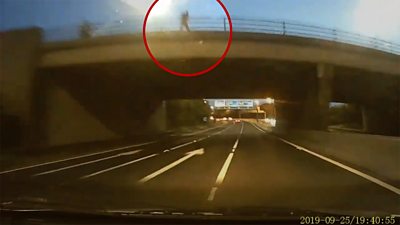 Moment stone-throwing thug shatters car windscreen on motorway - BBC News