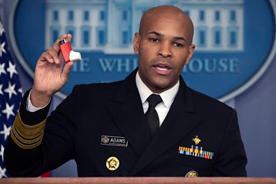 US Surgeon General Jerome Adams shows his inhaler - BBC News
