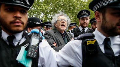Corbyn's brother arrested at anti-lockdown protest in London - BBC News