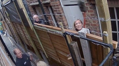 Woman hits neighbour with cement thrown over fence - BBC News