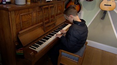Bristol boy with ADHD teaches himself piano in 11 months - BBC News
