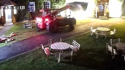 Watch: CCTV shows digger repeatedly ram restaurant - BBC News