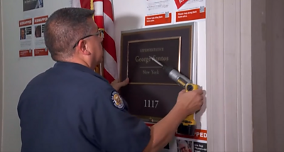 The moment George Santos' sign is removed from his office - BBC News