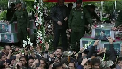 Iran: Mourners gather around President Raisi's funeral casket - BBC News