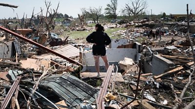 Drone shows path of destruction after deadly Iowa tornadoes - BBC News