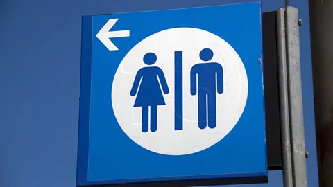 The genius behind stick figure toilet signs