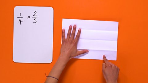 How to multiply fractions by folding paper - BBC Bitesize
