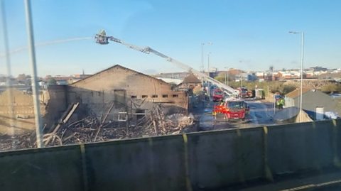 Wolverhampton railway reopens after major fire at factories - BBC News