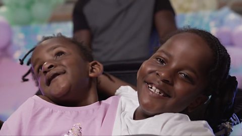 Designers make bespoke fashion for conjoined twins - BBC News