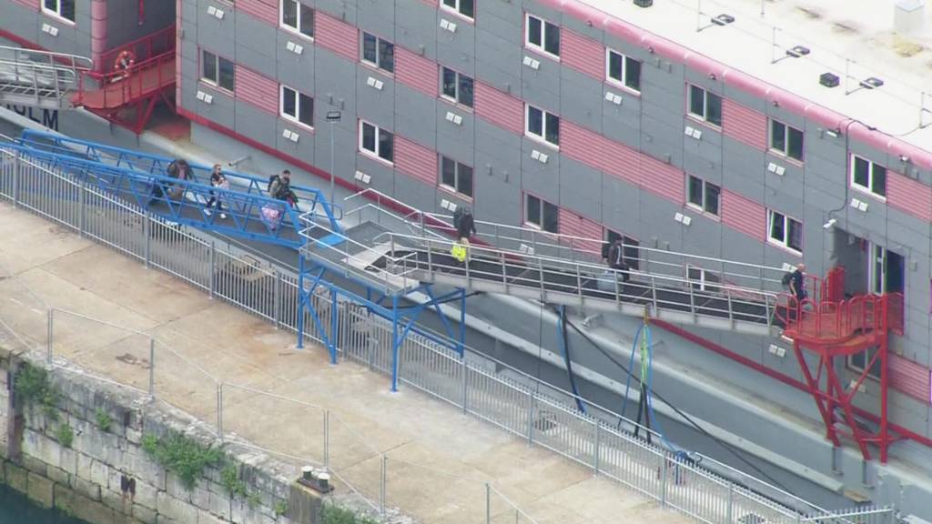 Bibby Stockholm: Fifteen asylum seekers board on first day using barge ...