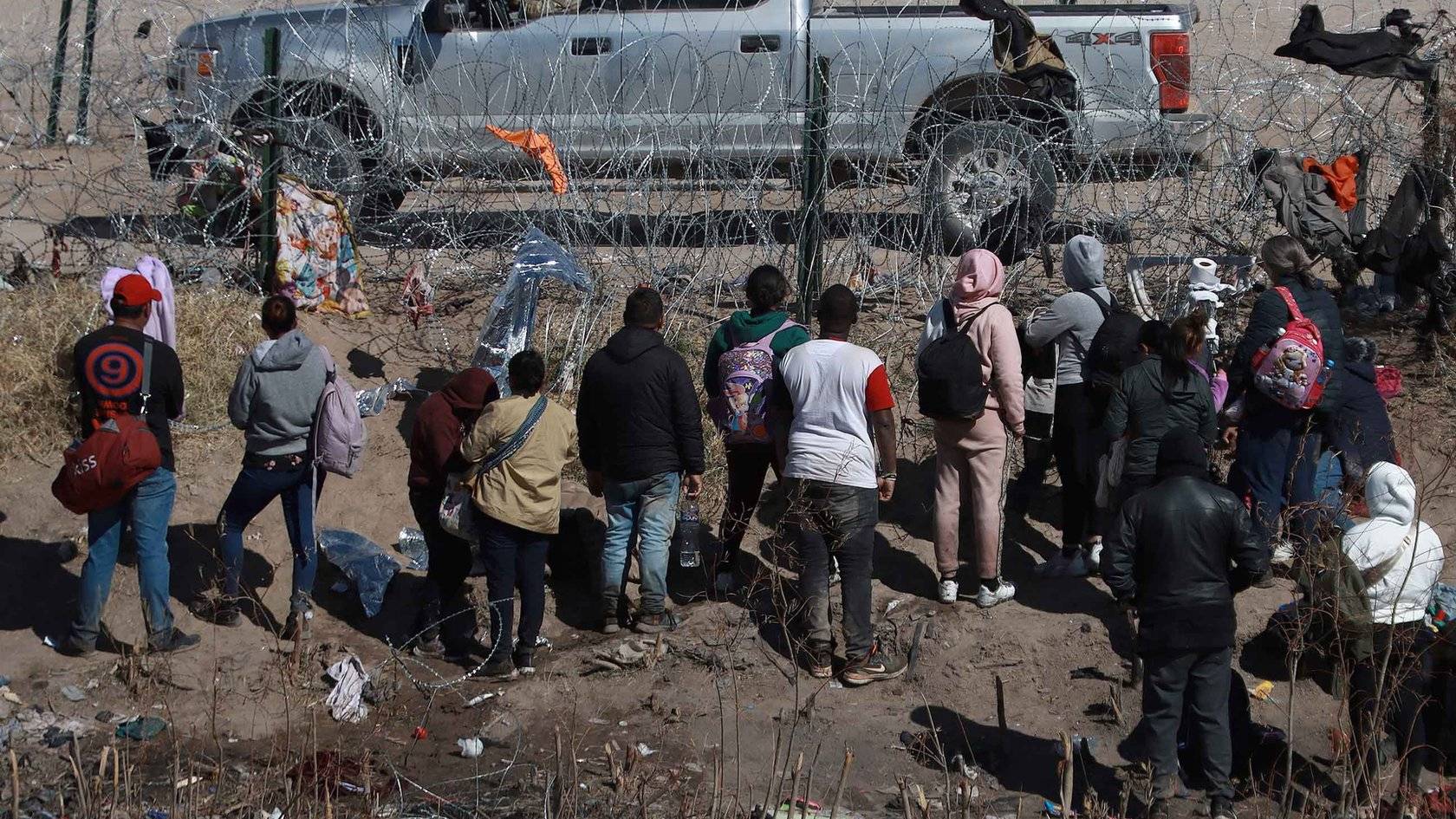 Biden urges Republicans to show 'spine' on border, as Trump goes on ...