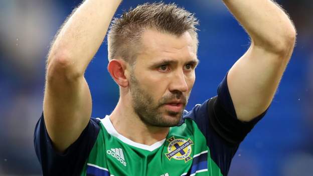 Gareth McAuley decides to continue Northern Ireland career - BBC Sport