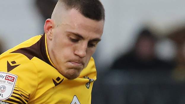 Ben Goodliffe: Sutton defender out for six months with cruciate ...