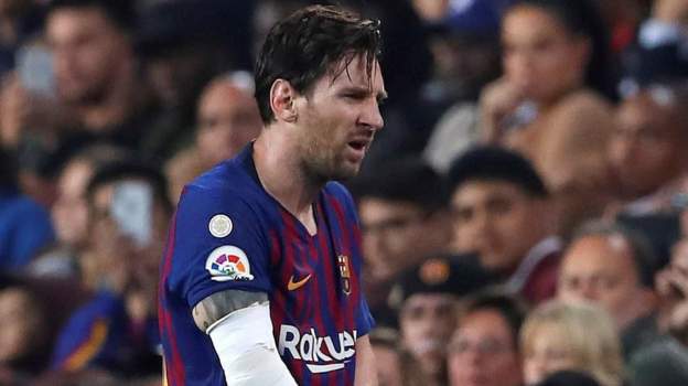 Lionel Messi suffers arm injury in Barcelona's win over Sevilla - BBC Sport