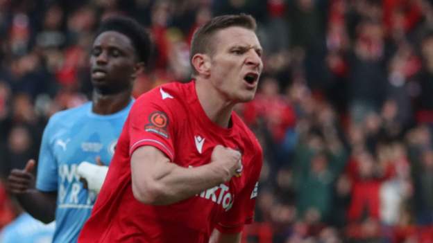 Paul Mullin: Wrexham striker to return 'within weeks' from punctured ...