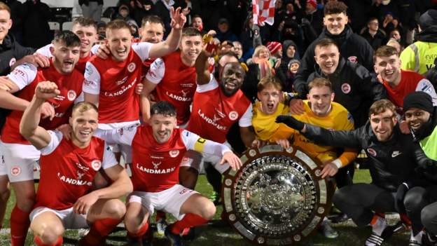 County Antrim Shield final: Larne complete hat-trick with shootout win after lengthy injury ...