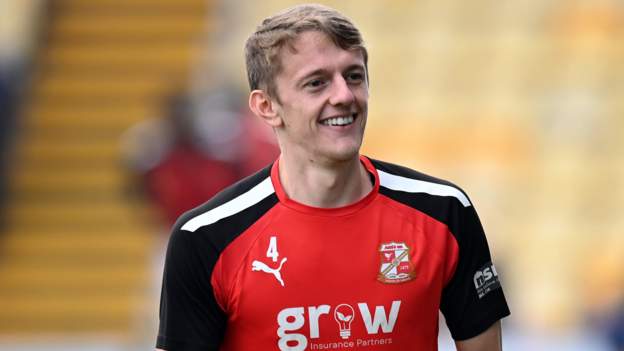 Tom Clayton: Swindon defender says squad is capable of reaching the ...