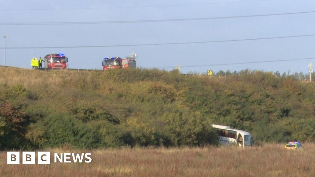 Bus crashes down A1 embankment