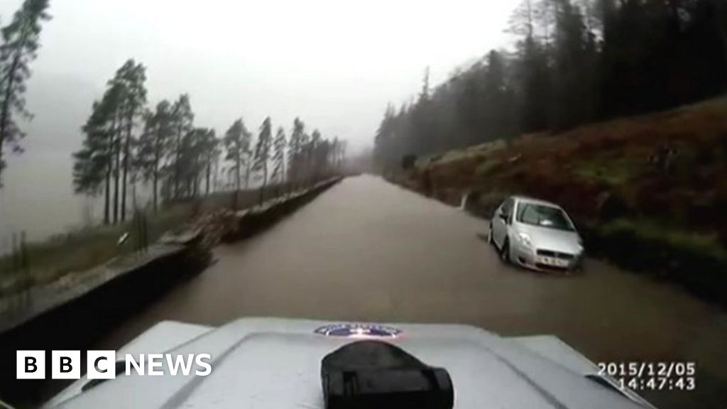 Dashcam footage shows rescue teams brave floods in Cumbria - BBC News