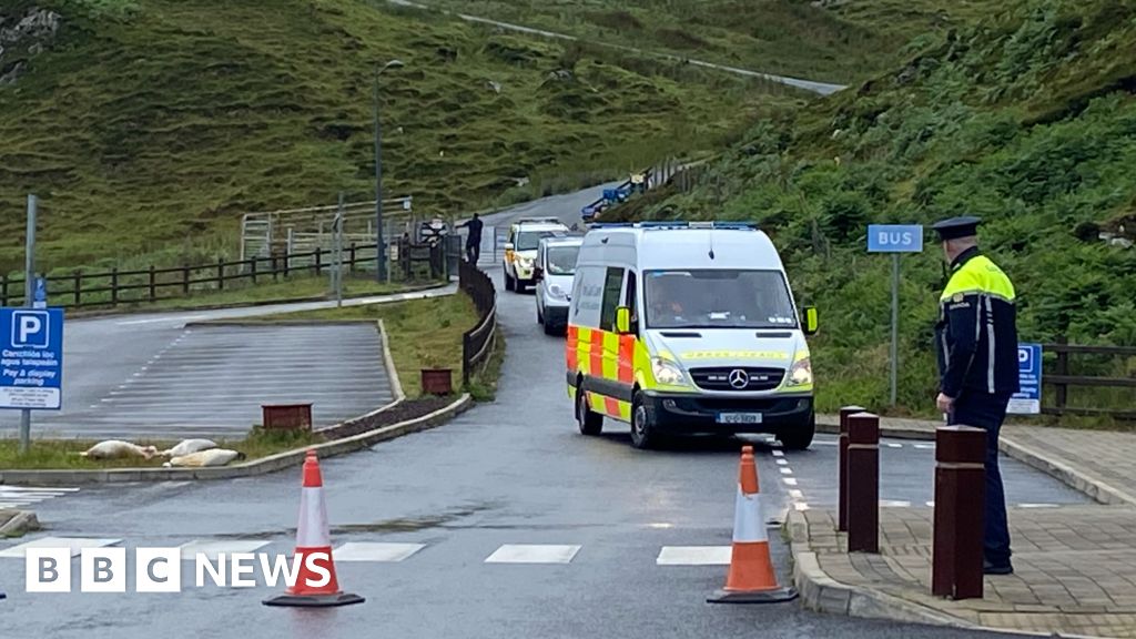 Body found at sea cliffs after alleged assault - BBC News