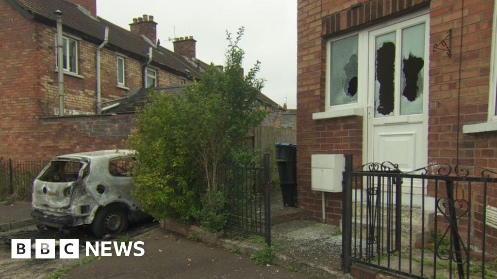 West Belfast: Families move out of homes after race hate crimes