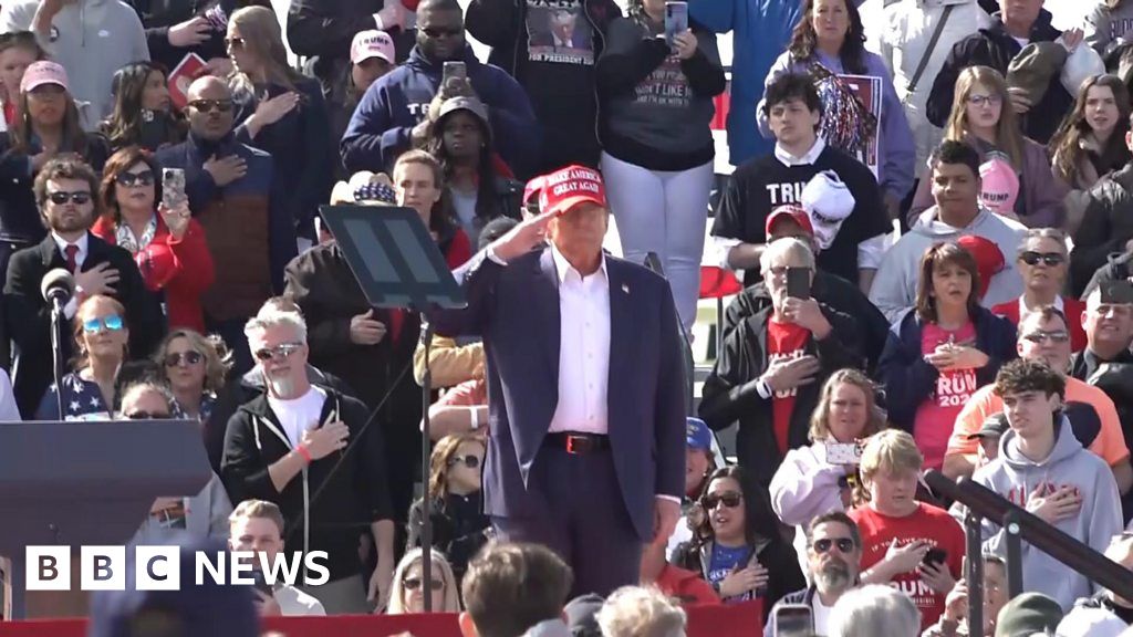 Donald Trump salutes as song by January 6 rioters plays at March rally
