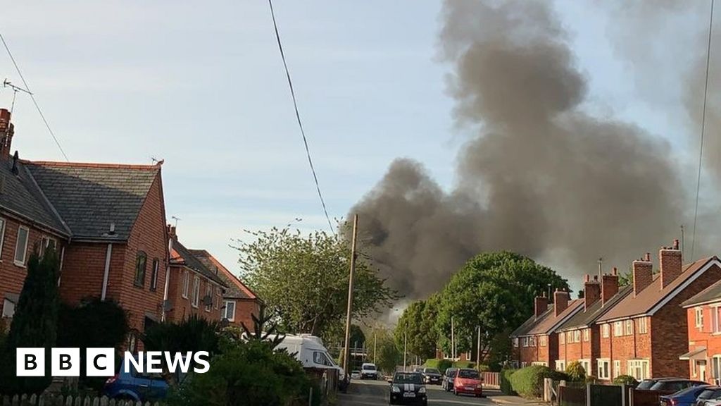 Thick black smoke seen as Wrexham landfill site burns