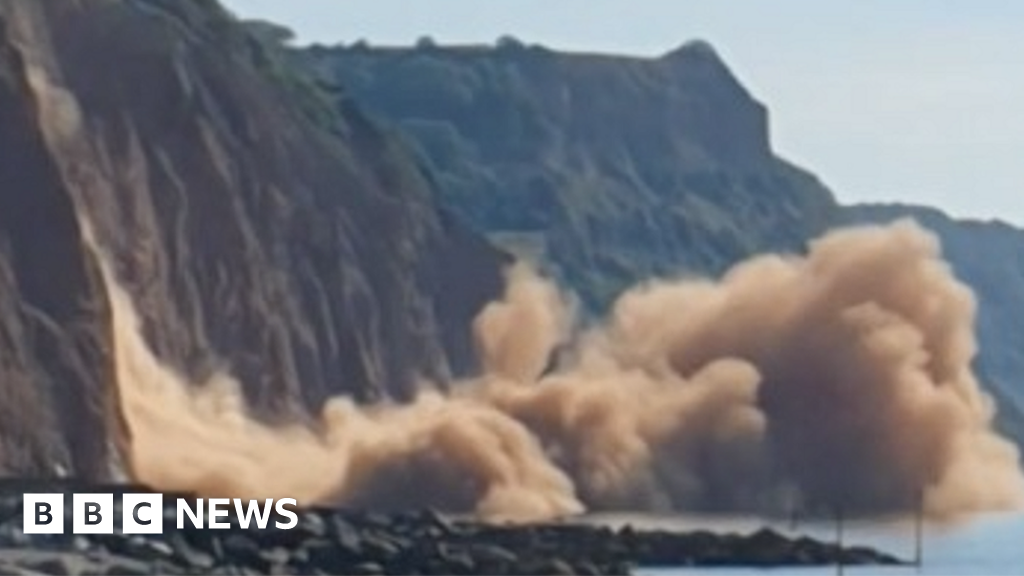 Sidmouth cliff falls send clouds of dust into air - BBC News