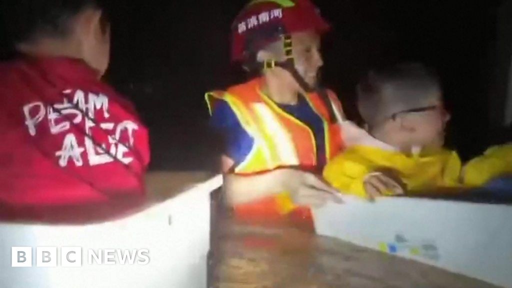Commuters and children rescued from China floodwaters Commuters and children rescued from China floodwaters