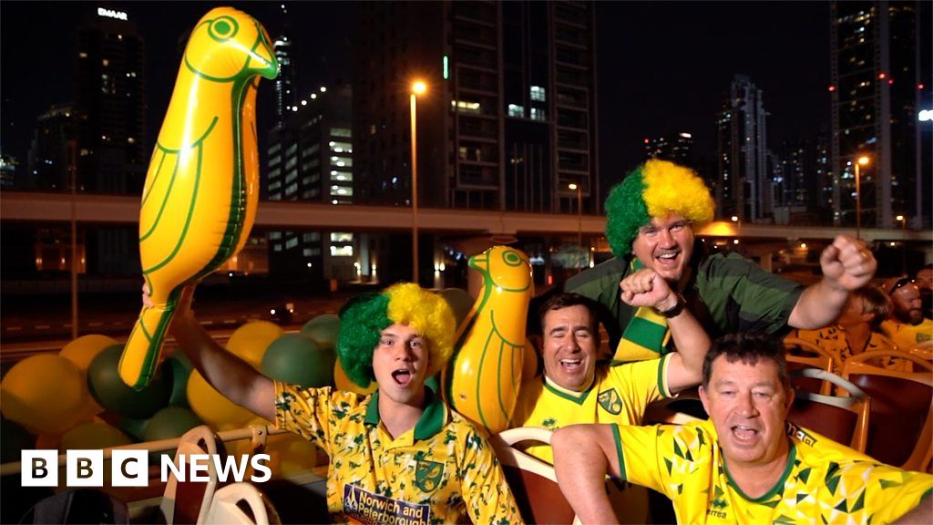 Norwich City ex-pat fans hold bus parade in Dubai - BBC News